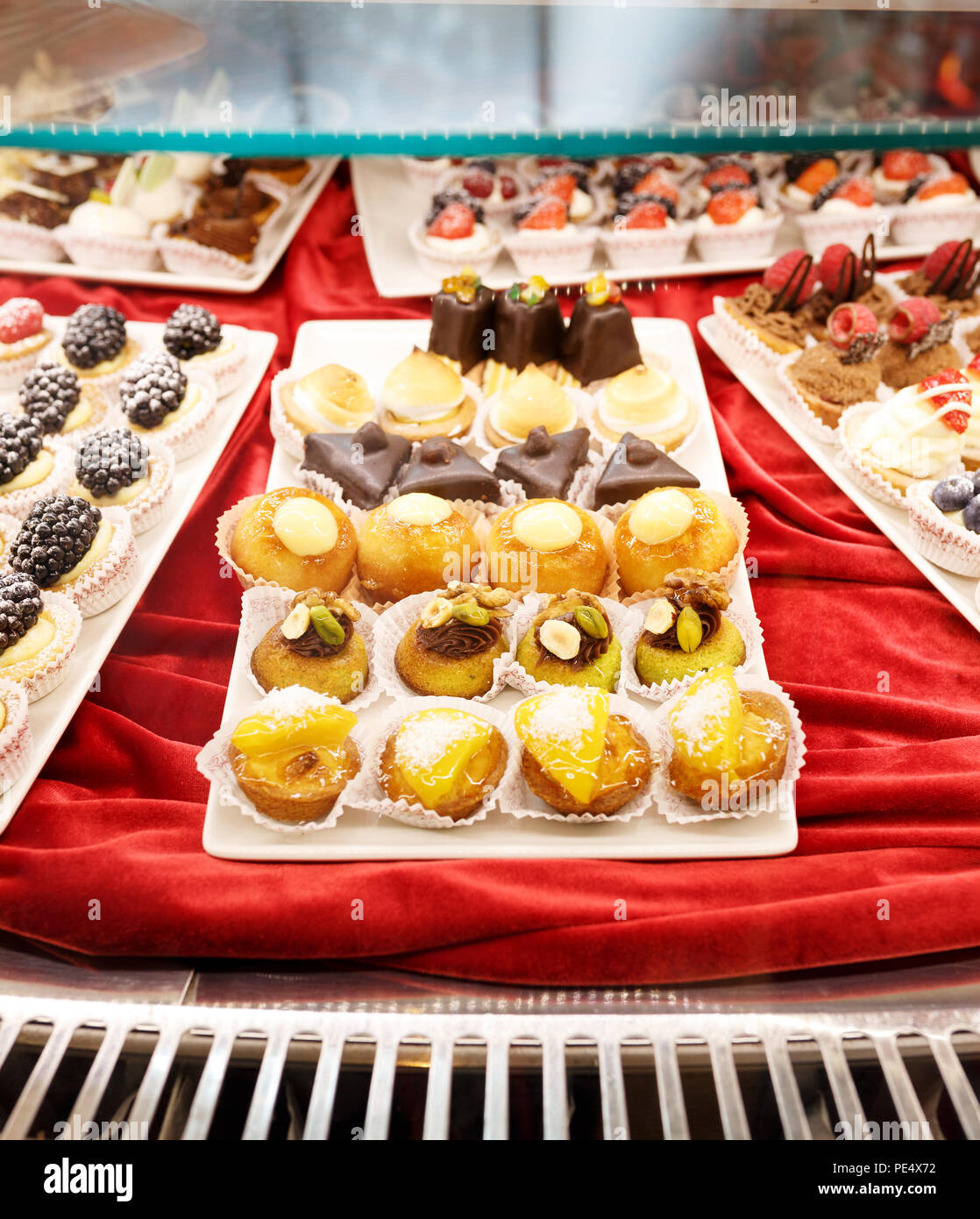 Cafe with a display of different cakes hi-res stock photography and ...