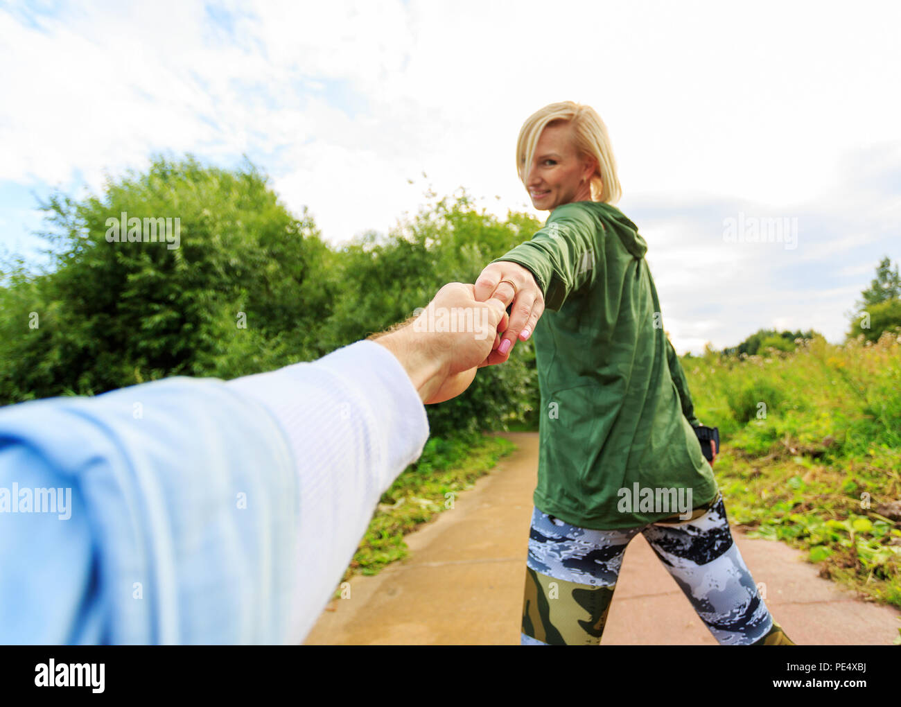 Two People Reaching Out For Each Other High Resolution Stock ...