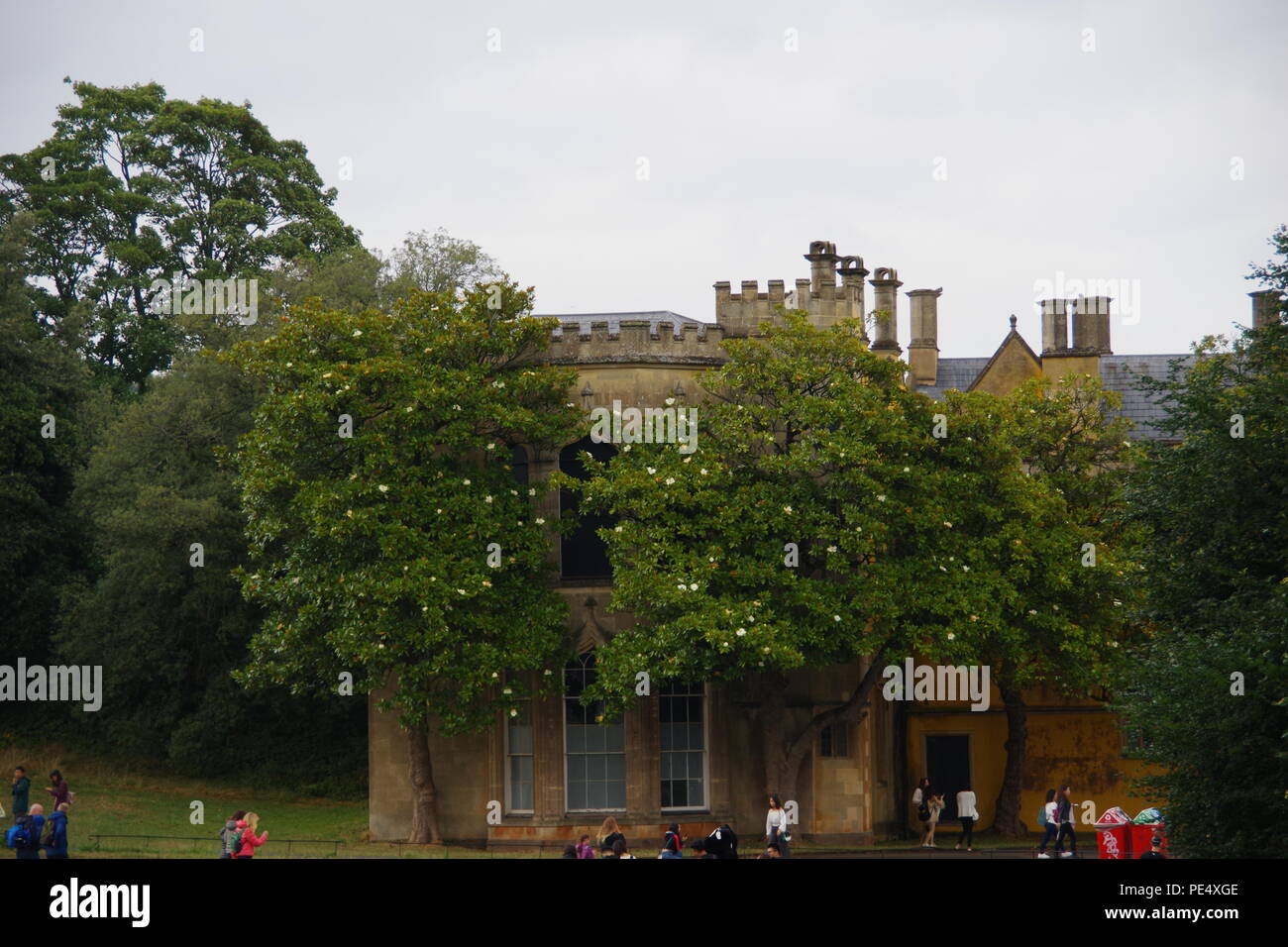Trees and Tourists in front of Ashton Court Mansion on a Cloudy Summers ...