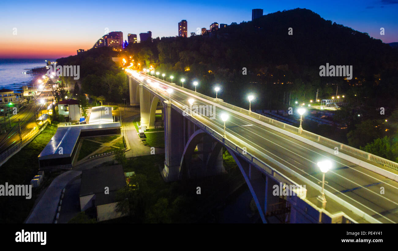 Drone view of the illuminated Matsesta viaduct and the mountain with ...