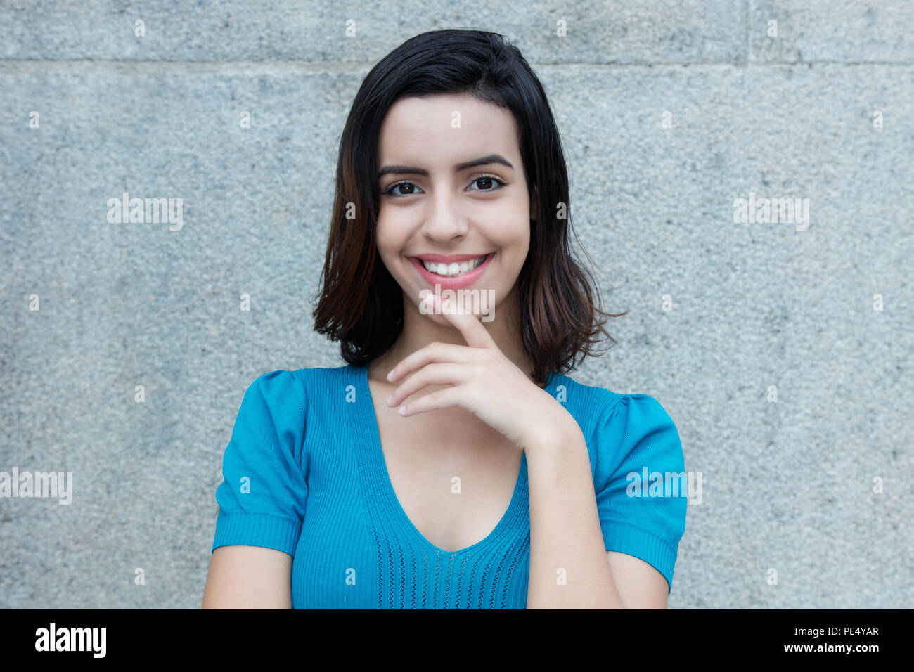 Hispanic woman laughing hi-res stock photography and images - Alamy