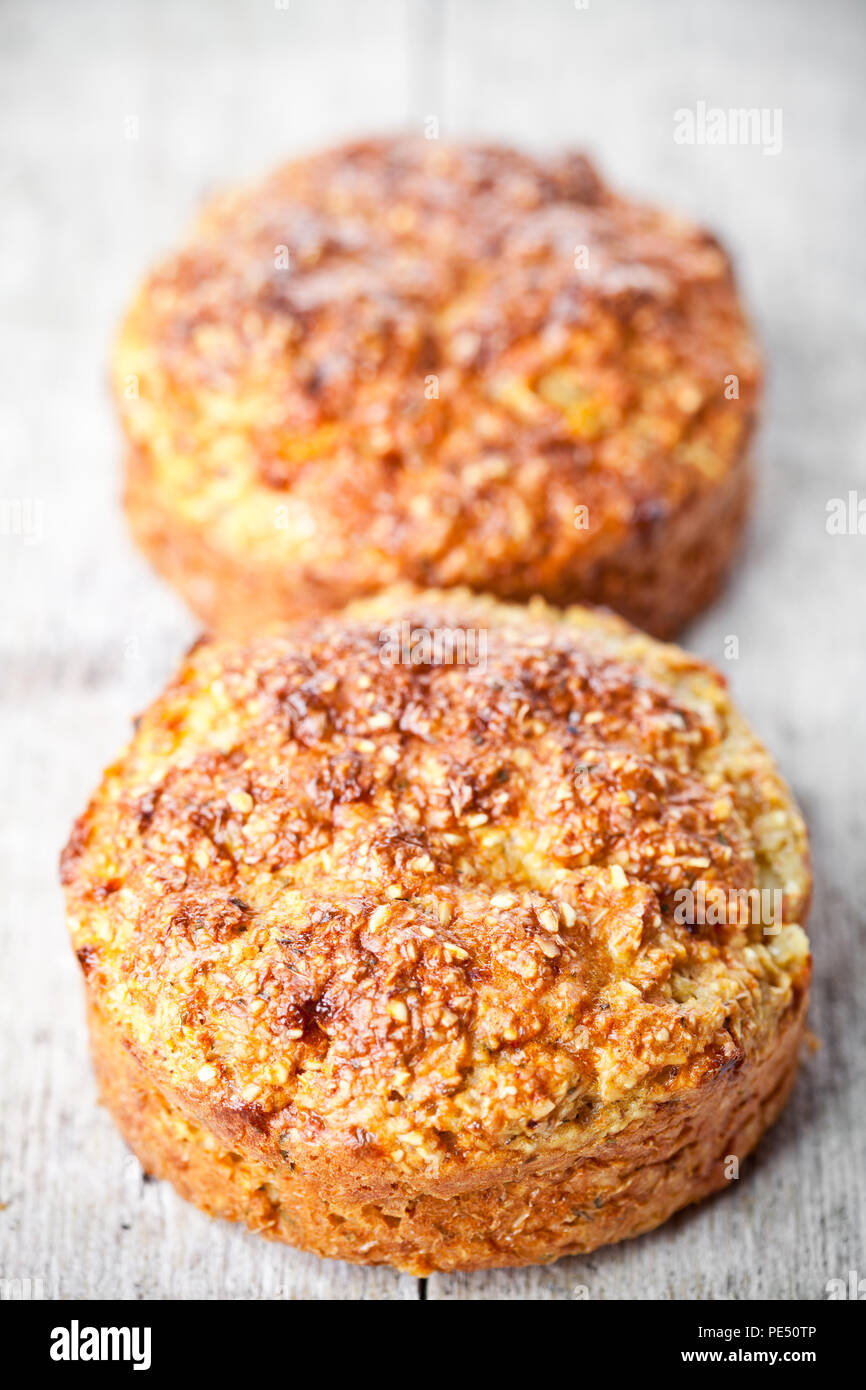 two fresh buns closeup on wooden table Stock Photo - Alamy