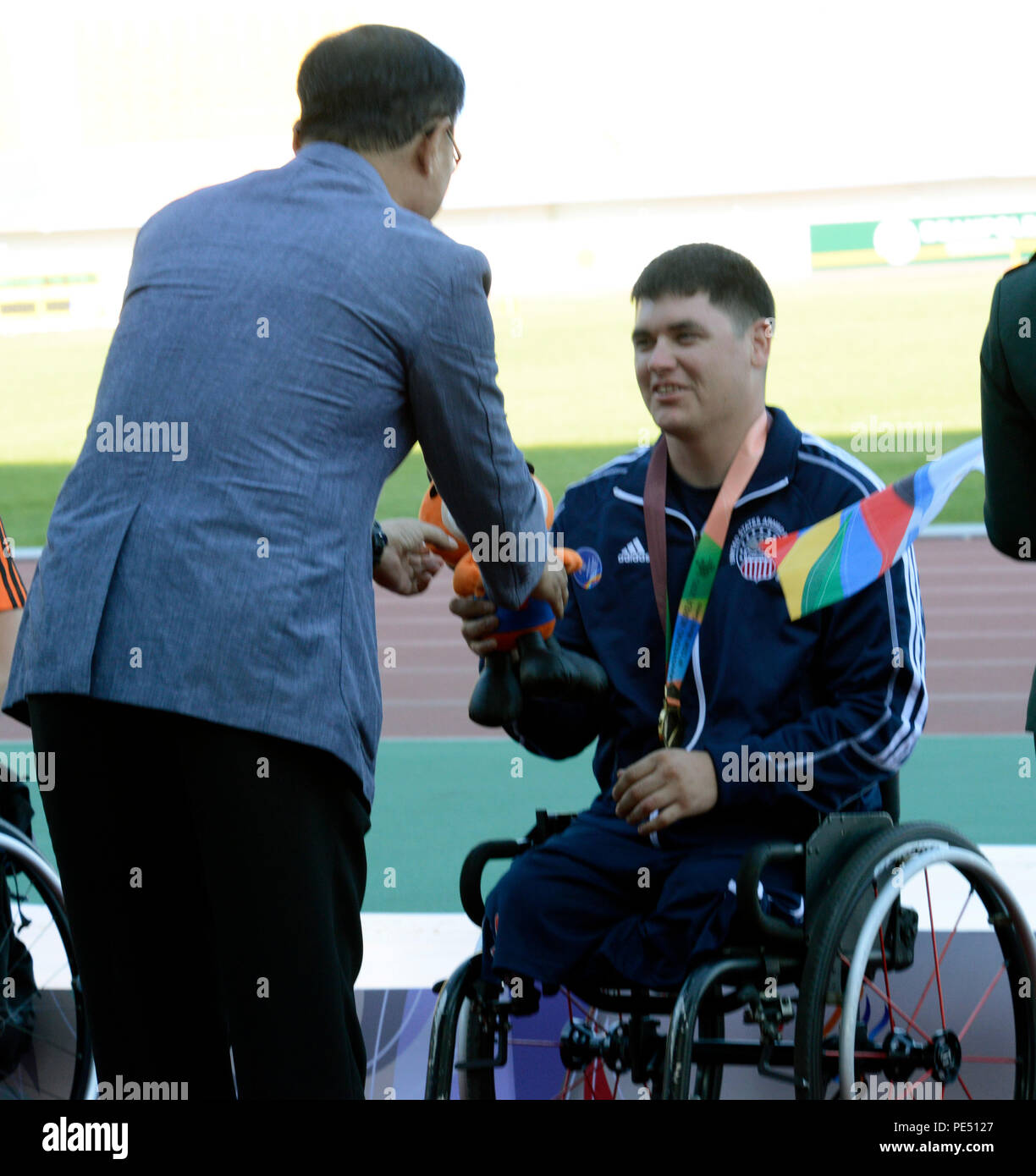 U.S. Marine Corps Sgt. Ivan Sears wears his gold medal as Korean Track ...