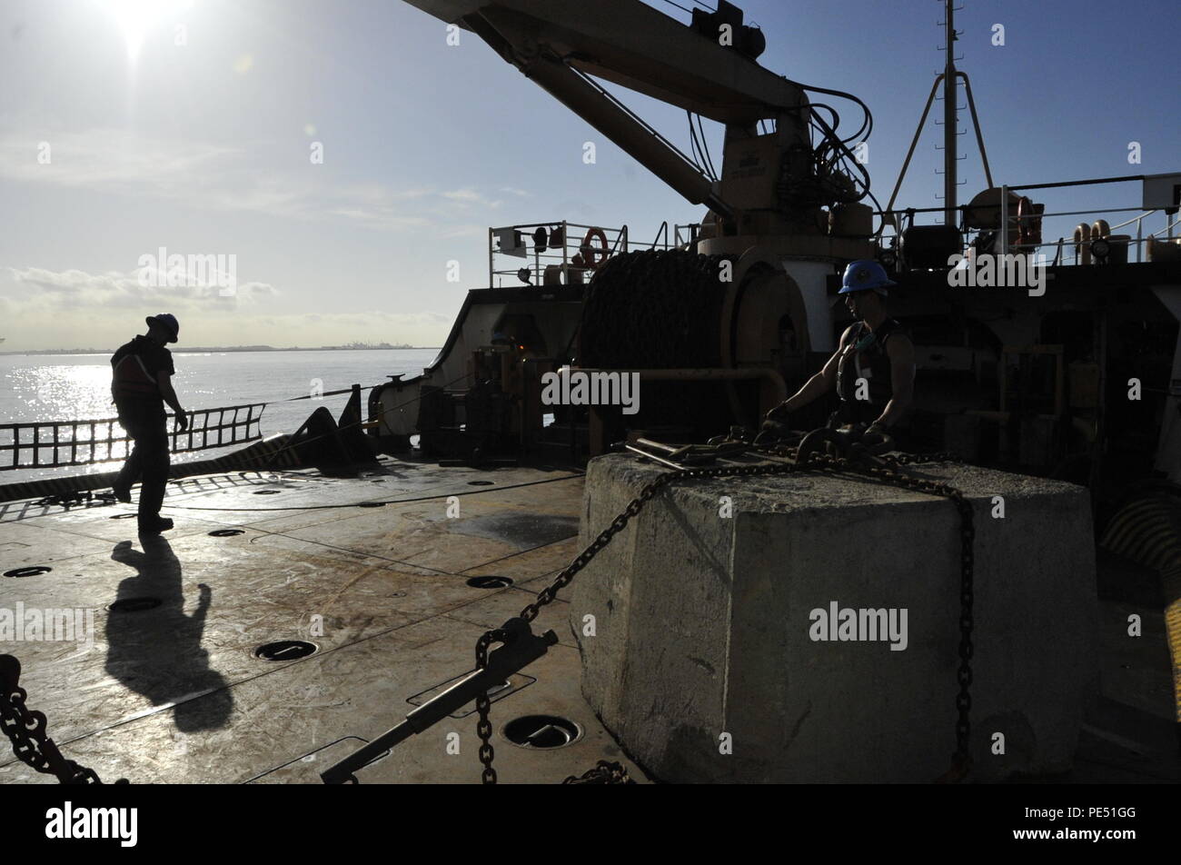 Members of the U.S. Coast Guard Cutter George Cobb place buoys in the ...