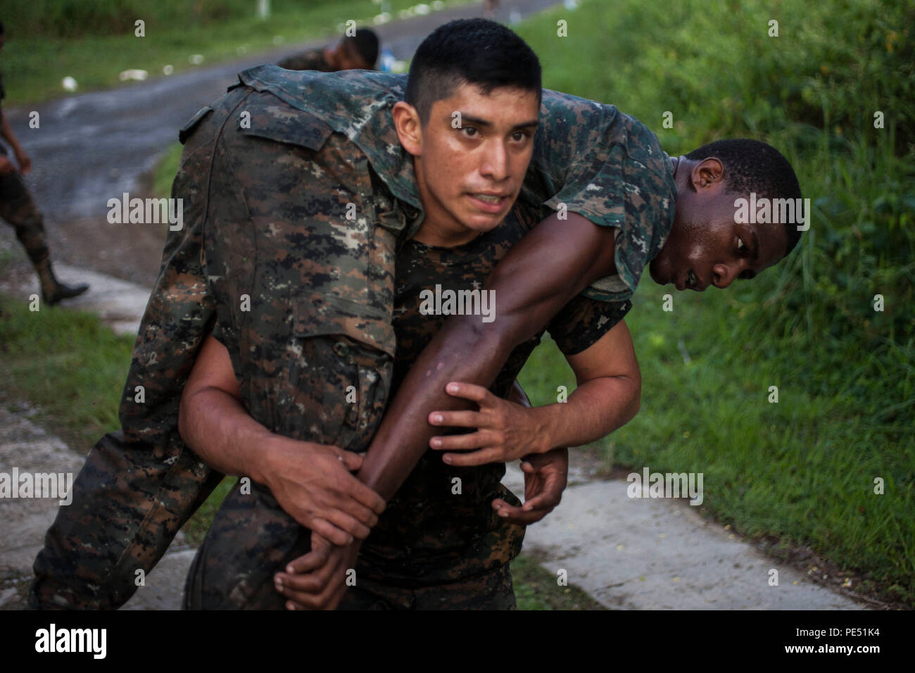 Cabo Luis Estrada, rifleman, Brigada de Infanteria Marina, fireman ...