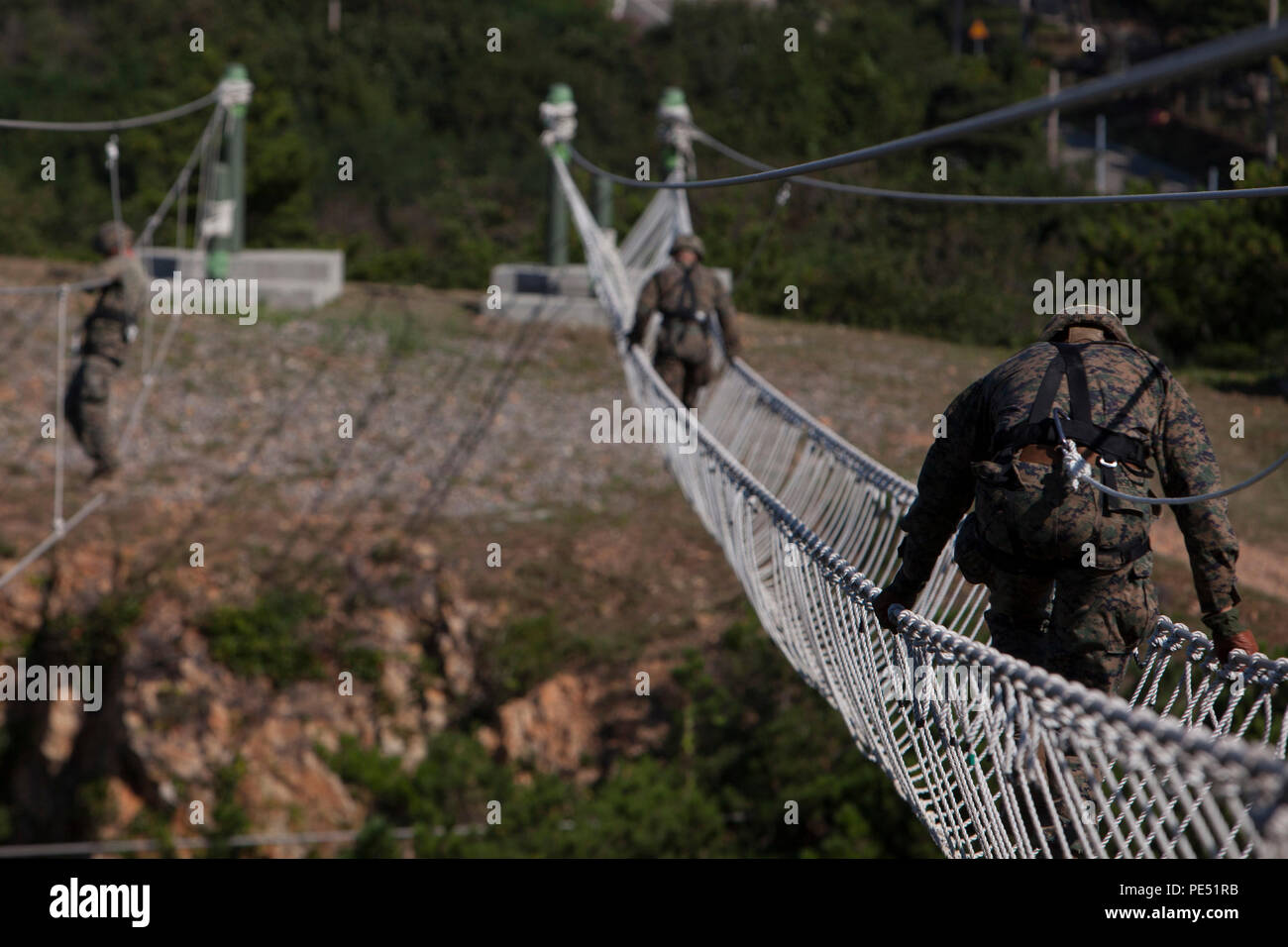 U.S. Marines cross various types of rope bridges at Baengnyeongdo ...
