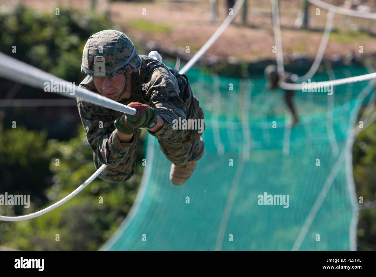 2nd Lt. Gregory L. Pack crosses a one rope bridge at Baengnyeongdo ...