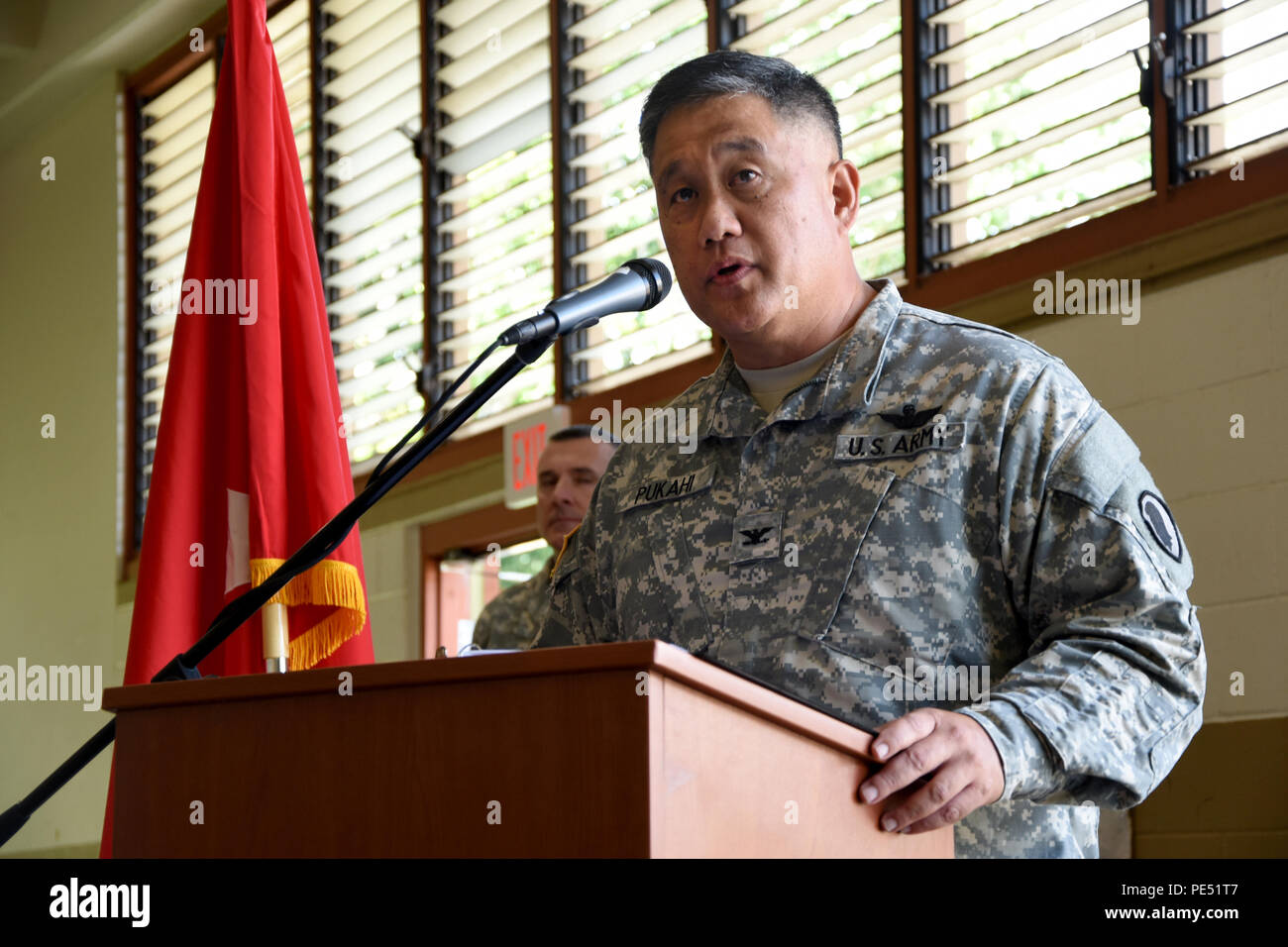 Col. Roger Pukahi assumes command of the 103rd Troop Command during a ...