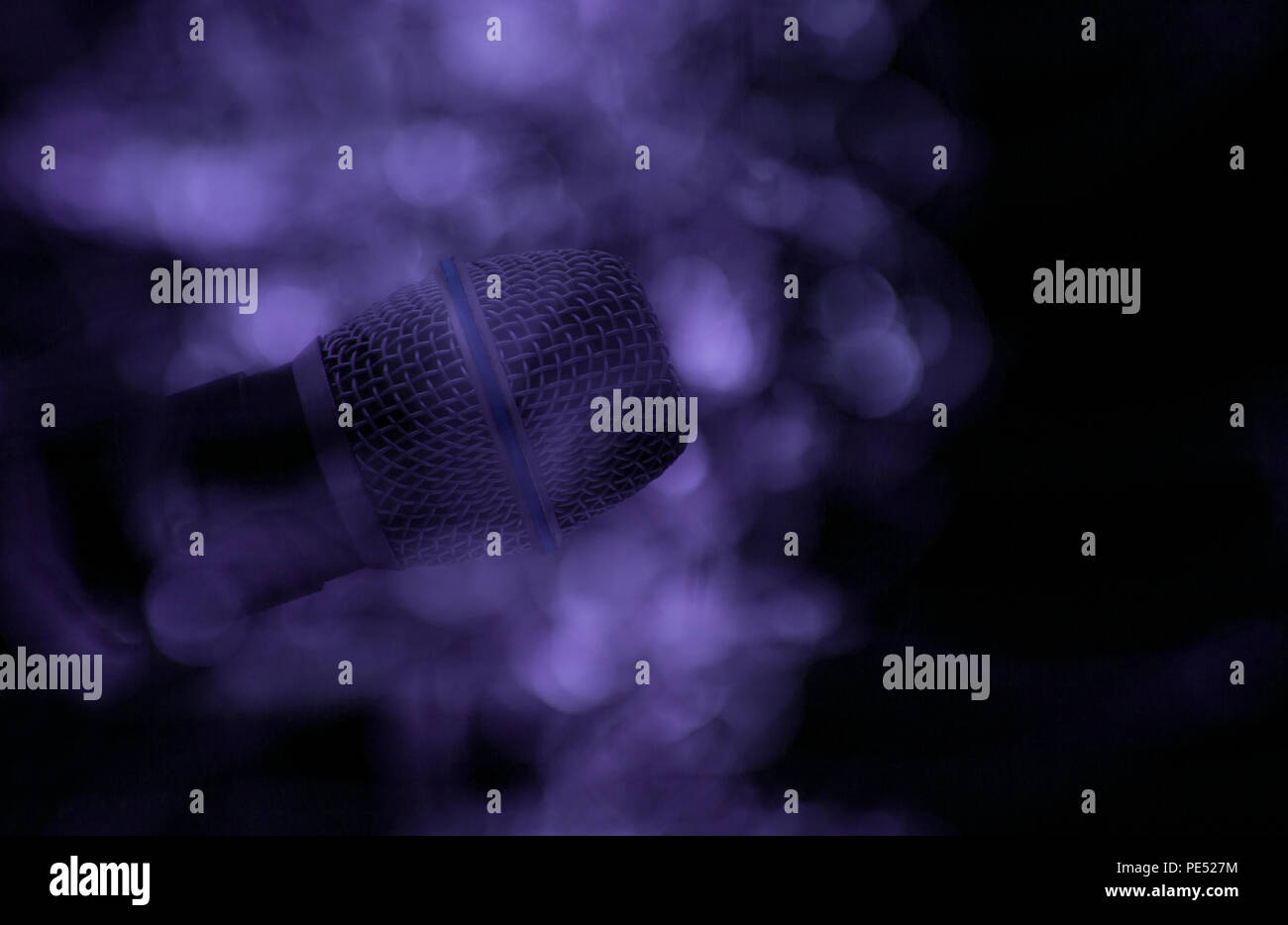 Karaoke party, mic on stage. Microphone on dark background Stock Photo ...