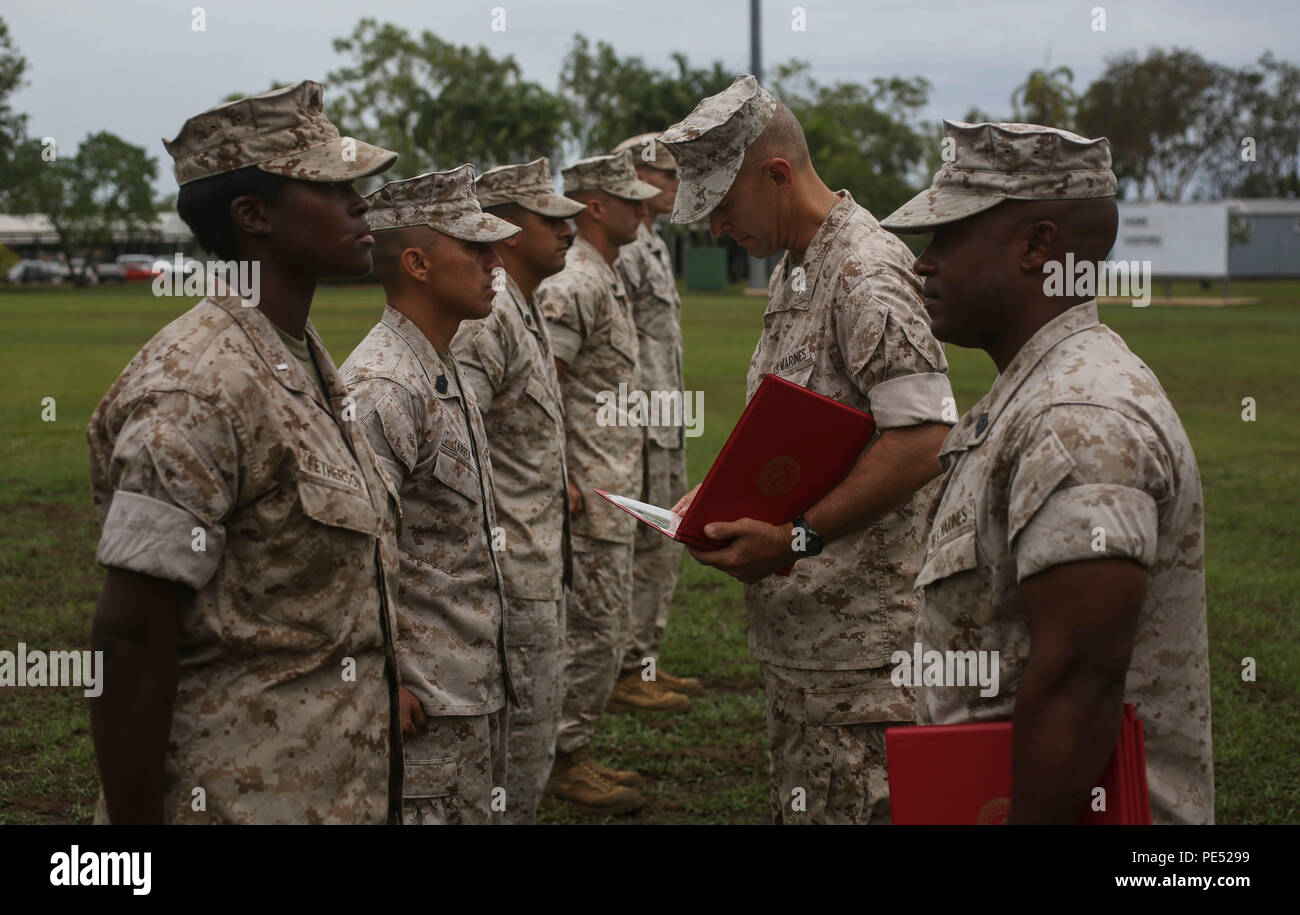 U.S. Marine Corps Col. David Odom and Sgt. Maj. Mario Fields present ...
