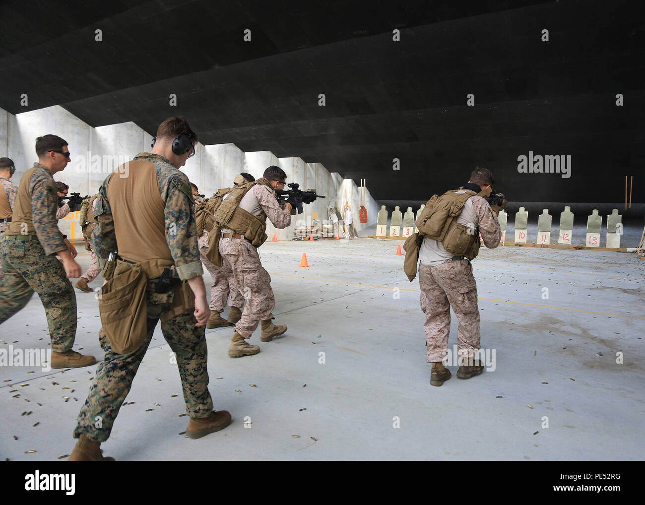U. S. Marine instructors, in green uniforms, from Expeditionary ...