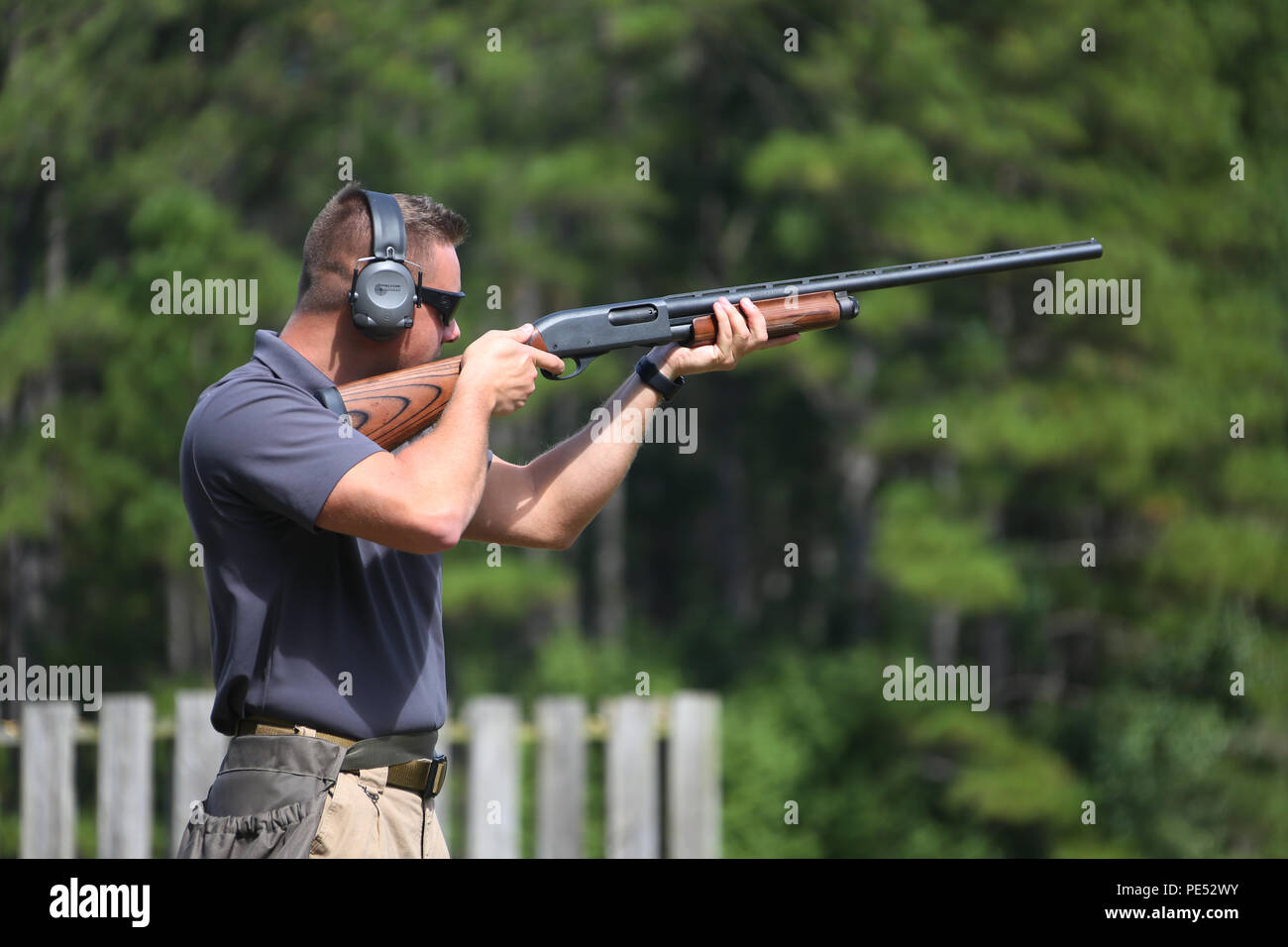 1st Lt. Benjamin Pearce fires his shotgun at a moving target during a ...