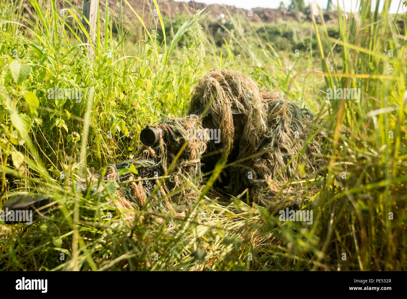 Philippine Marine Cpl. Rick Crampatanta sights in downrange with his ...