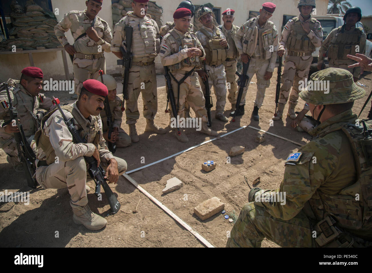 Iraqi soldiers attending a train-the-trainer course plan an urban ...