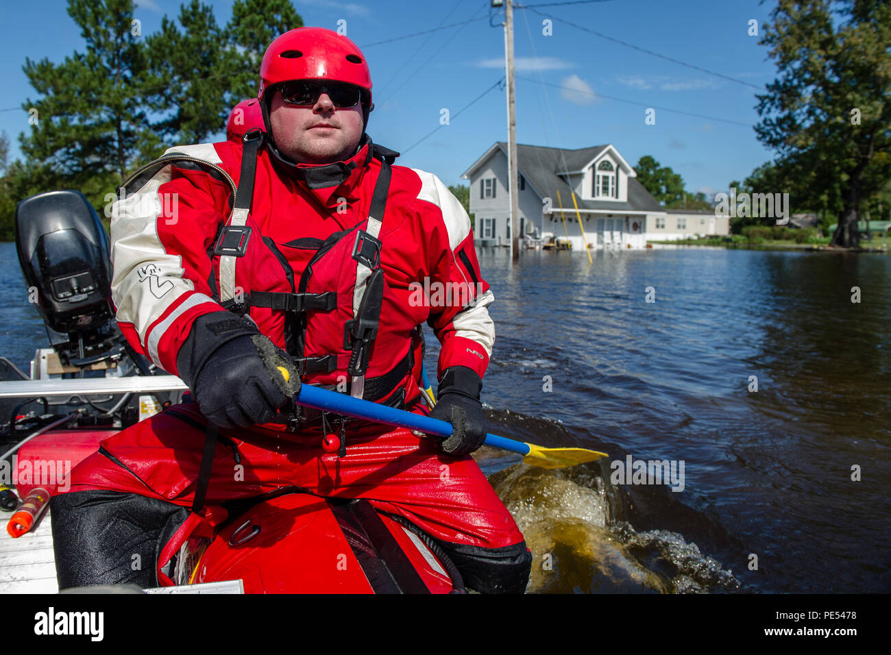 A swift water rescue firefighter from Columbia, Tenn., paddles through ...