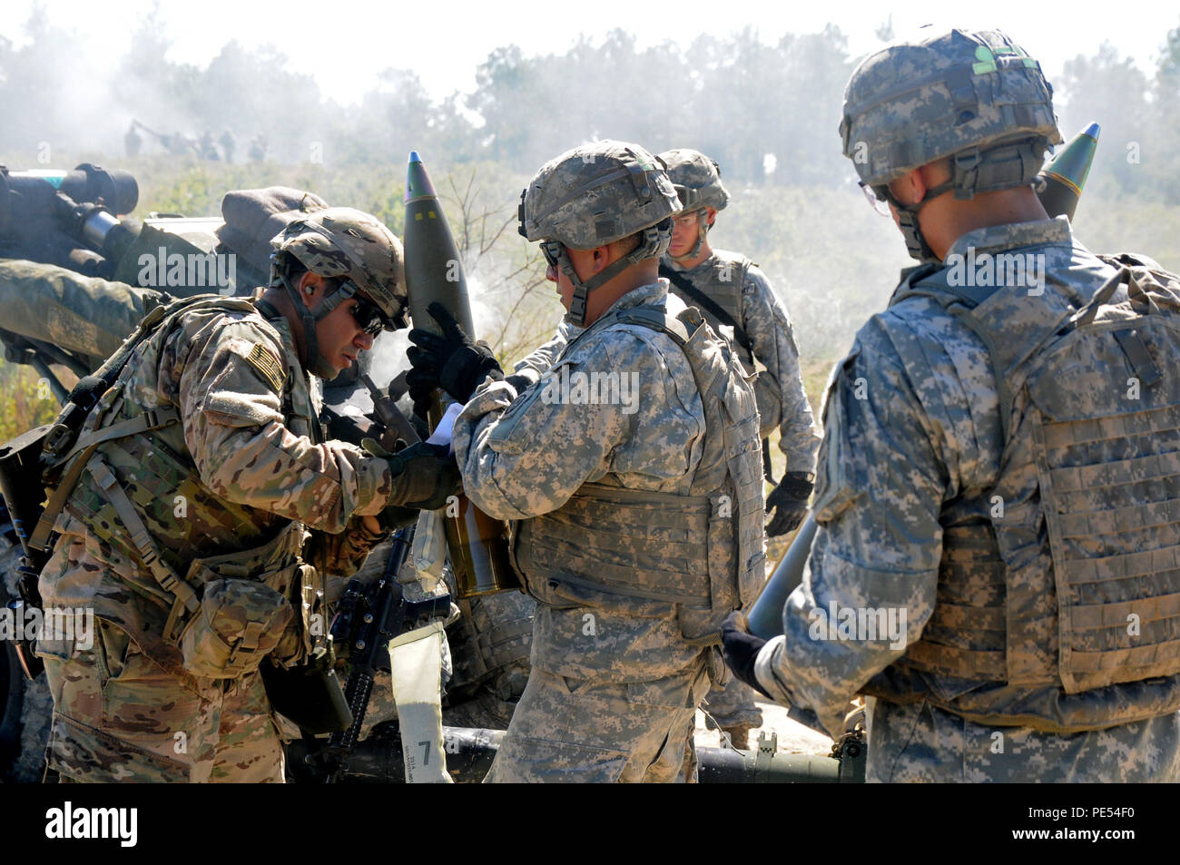 An M119A3 howitzer crew, assigned to 1st Battalion, 319th Airborne Field Artillery Regiment ...