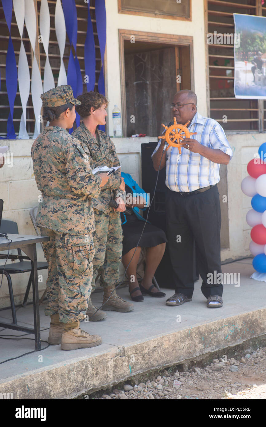 Winston Wepsta, School Director of Luky Yabayak, presents 1st Lt. Erin ...