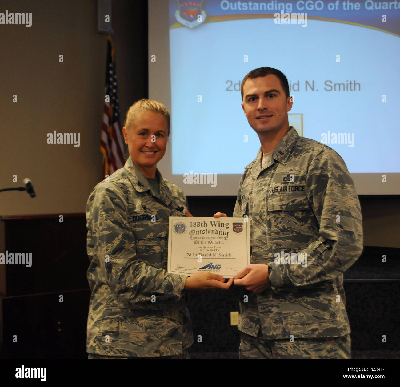 Second Lt. David Smith, 153rd Intelligence Squadron, receives the ...