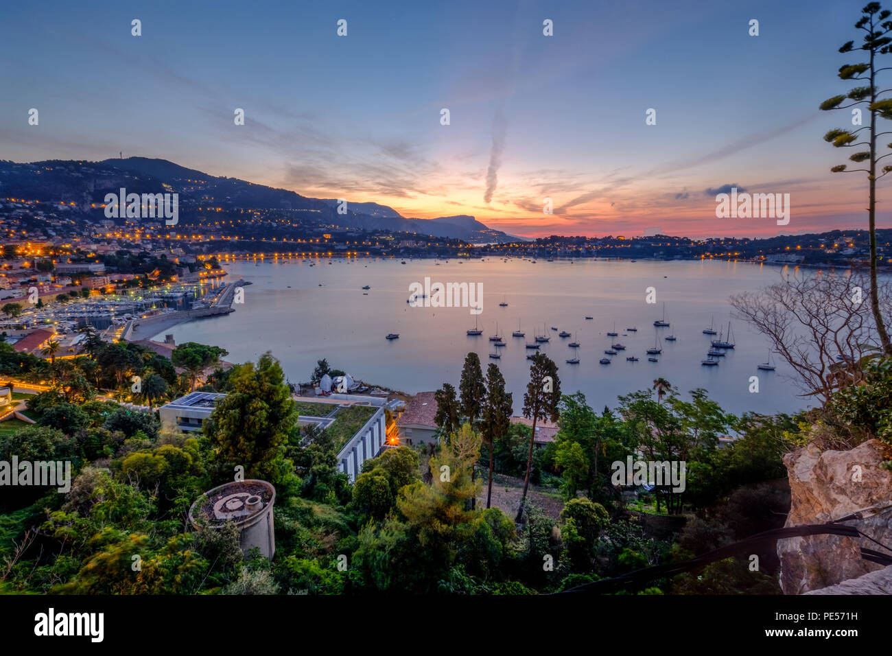 View of seaside town against red sky. Villefranche-sur-Mer in French ...