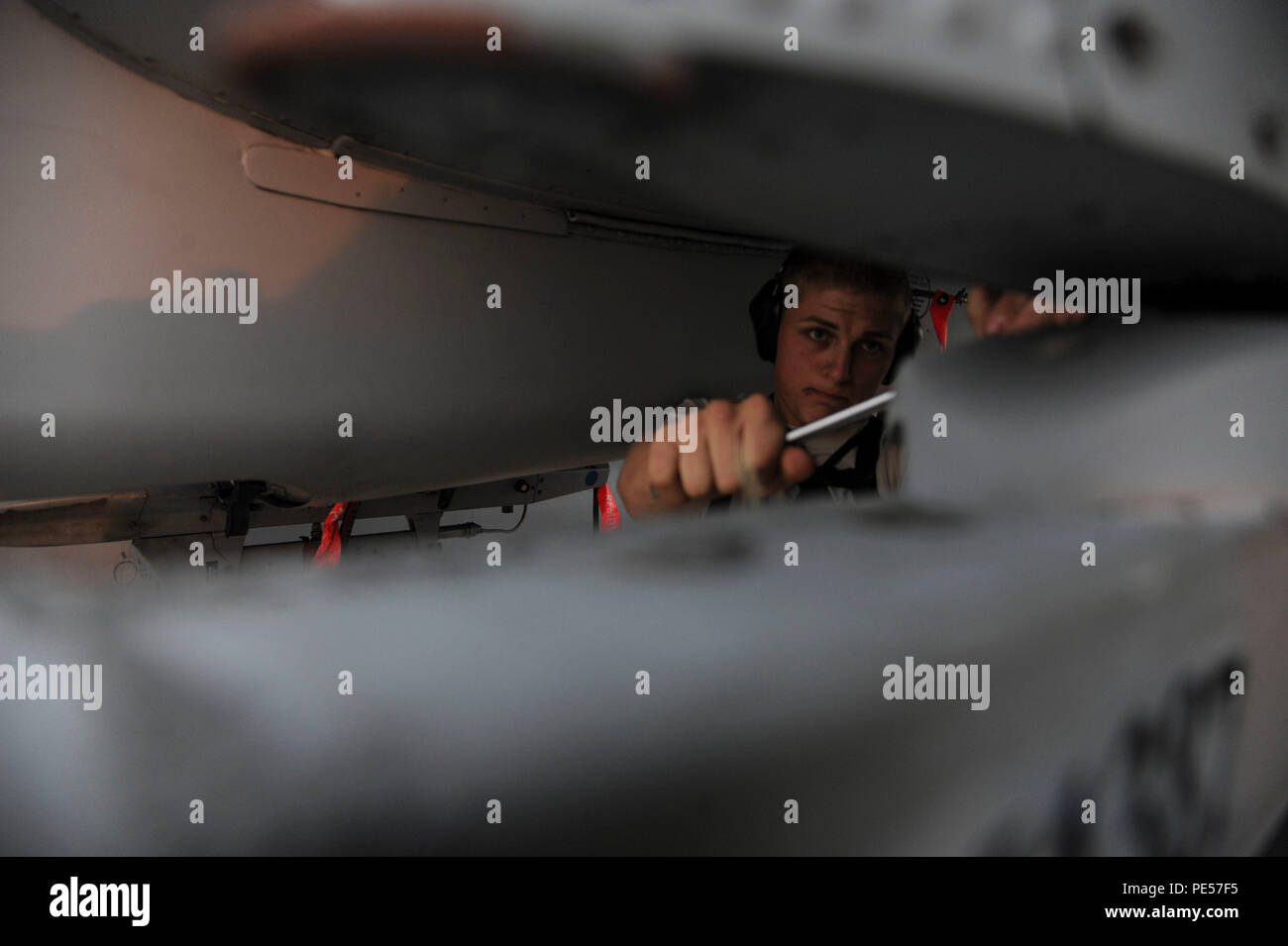 Airman 1st Class of the 74th Expeditionary Fighter Squadron tightens a ...