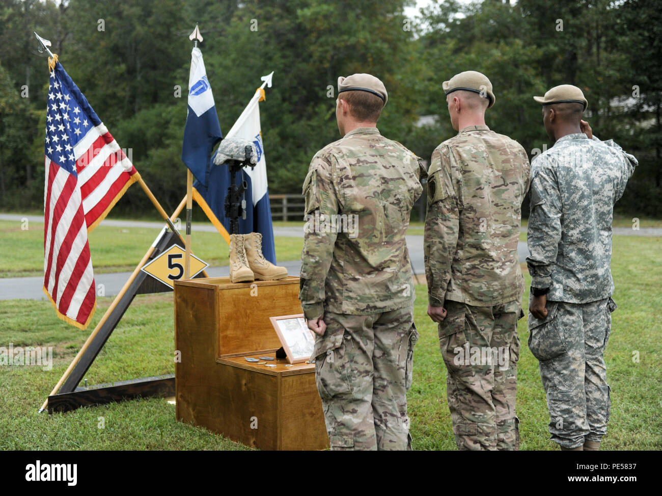 U.S. Army soldiers assigned 5th Ranger Battalion salute during a ...