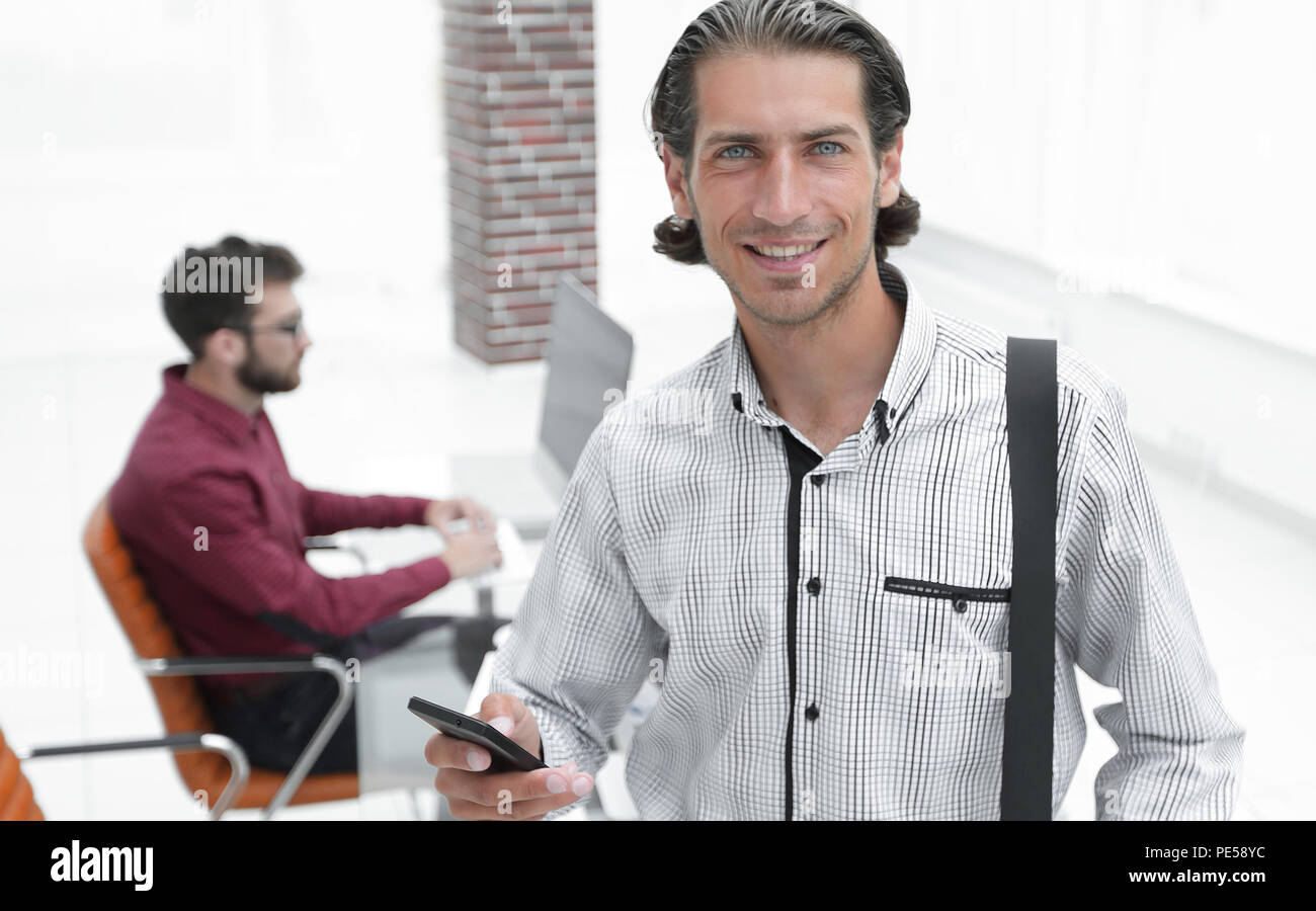 employee reads a text message on smartphone Stock Photo - Alamy