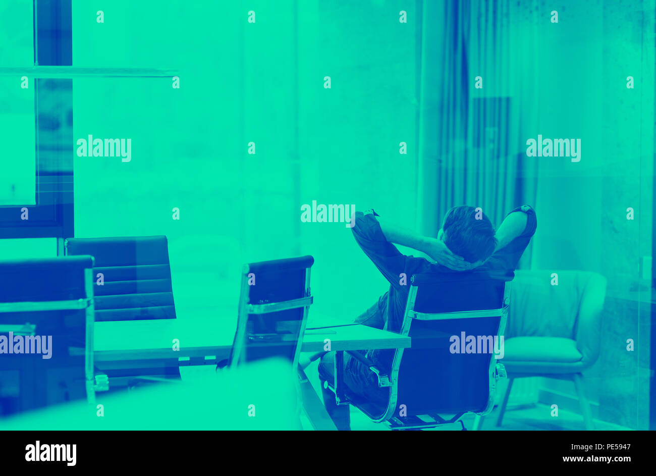 A time for relax. Young tired casual businessman relaxing at the desk ...