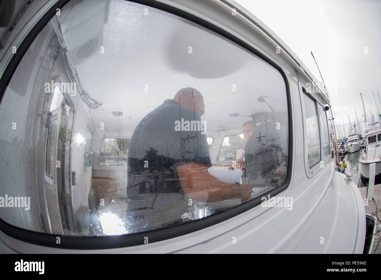 Lt. Cmdr. David Cripe, a Coast Guard marine inspector, checks proper ...