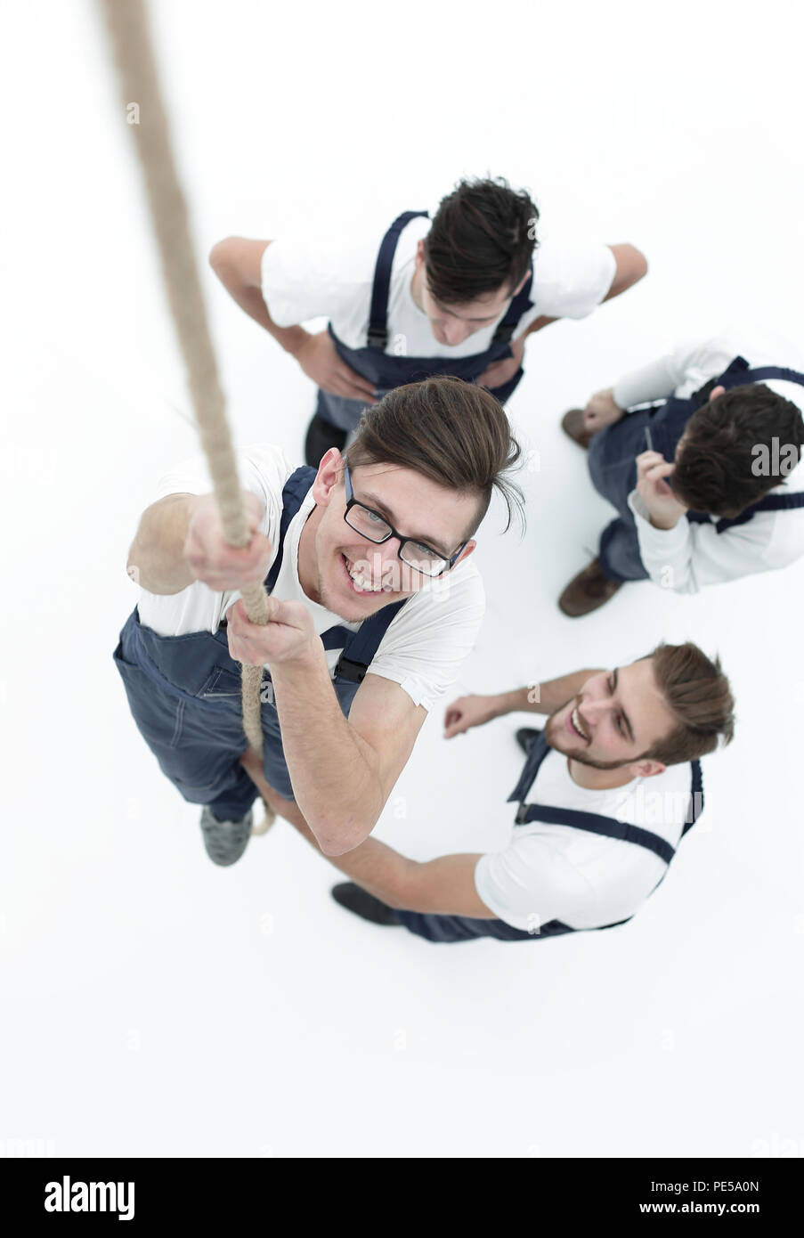 team, helping the leader to climb up the rope Stock Photo - Alamy