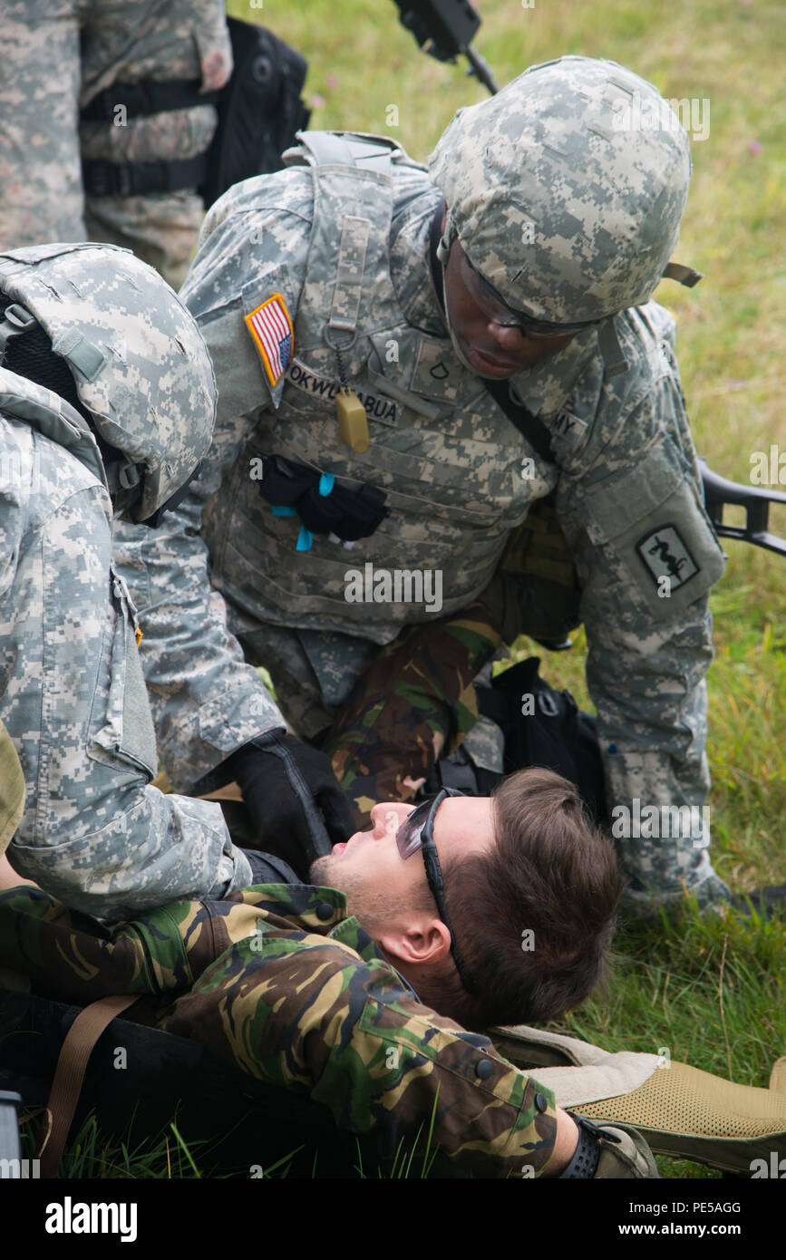 U.S. Soldiers checks a simulated casualties wounds during Tactical ...