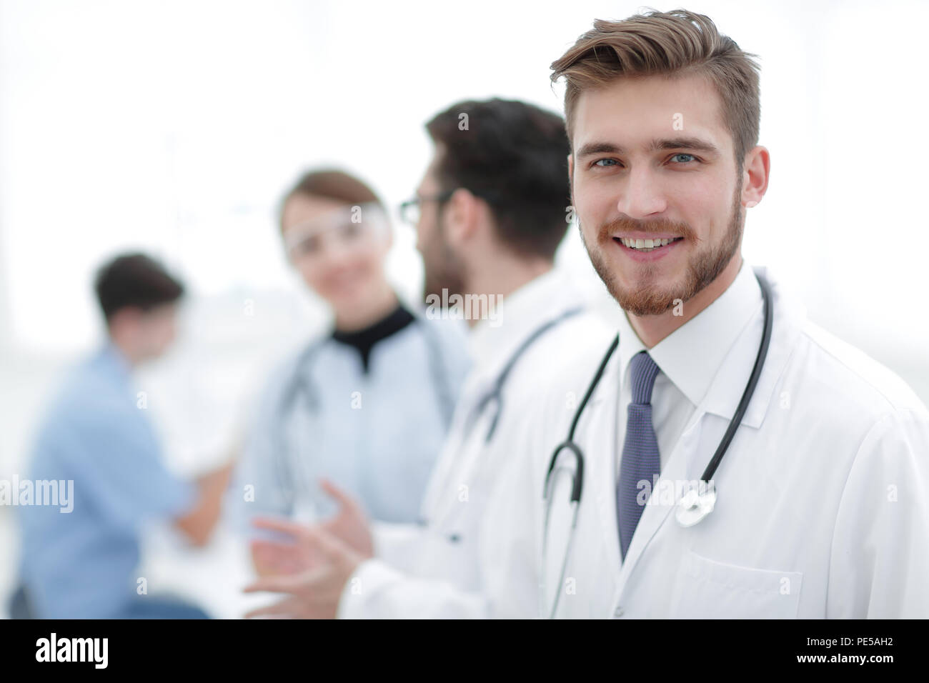 Portrait of friendly male doctor smiling Stock Photo - Alamy