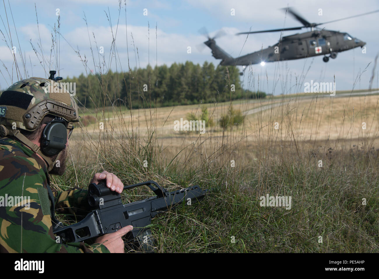 A Norwegian soldiers provide security for troops on the ground and over ...