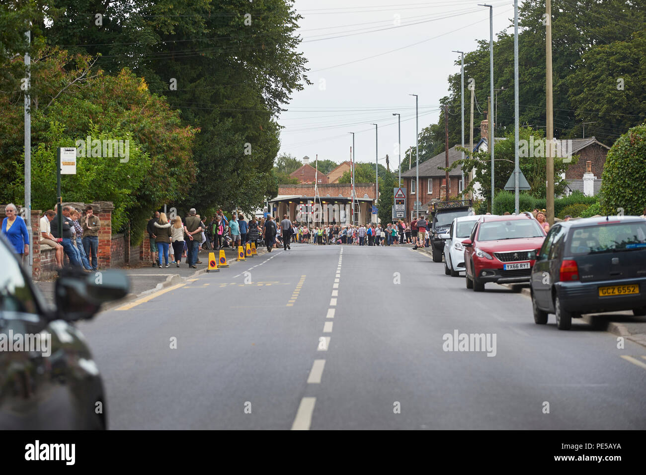 Crowds of people lining the street waiting for the steam engine road ...