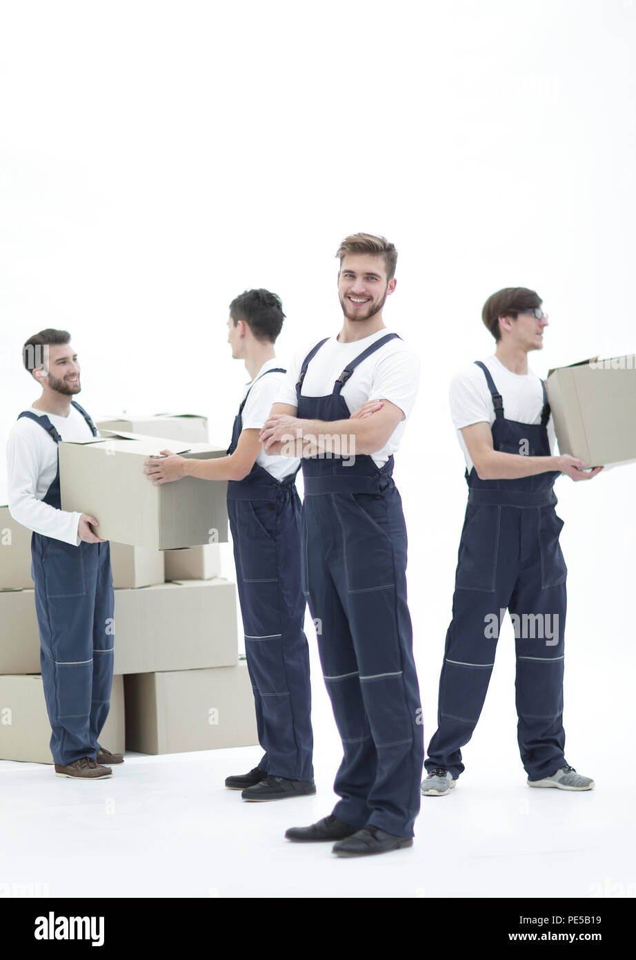 The team of responsible movers and their smiling leader Stock Photo - Alamy
