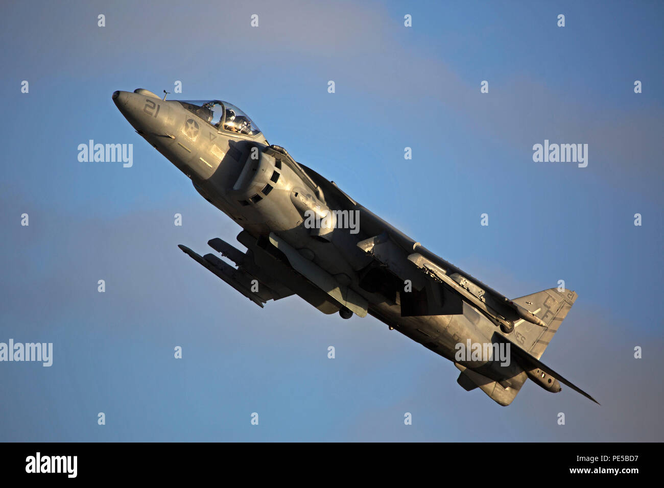 An AV-8B Harrier shows off its hovering and maneuvering capabilities ...
