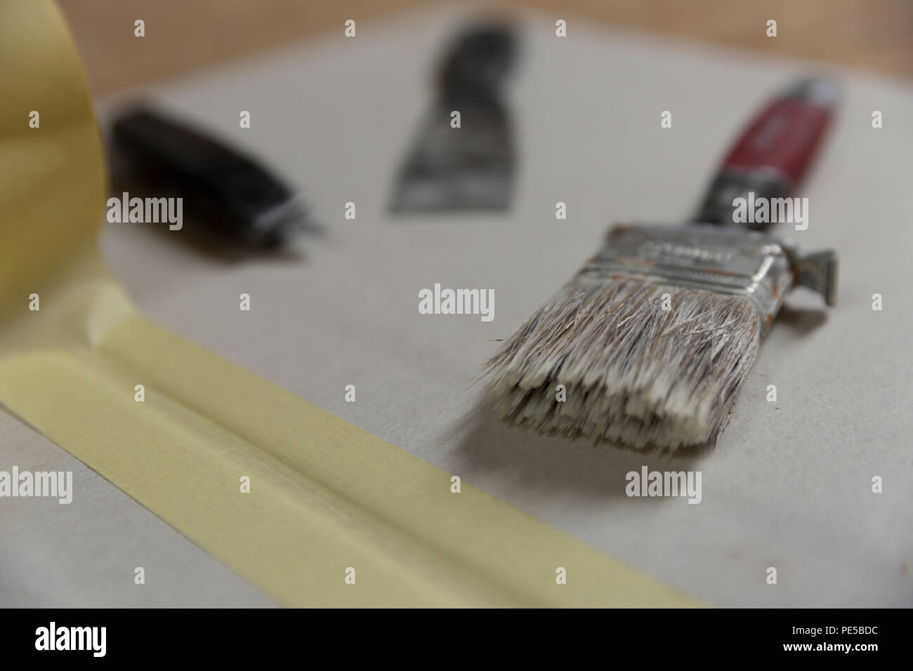 Painting tools for wooden board. Brush, coloring tape and construction ...