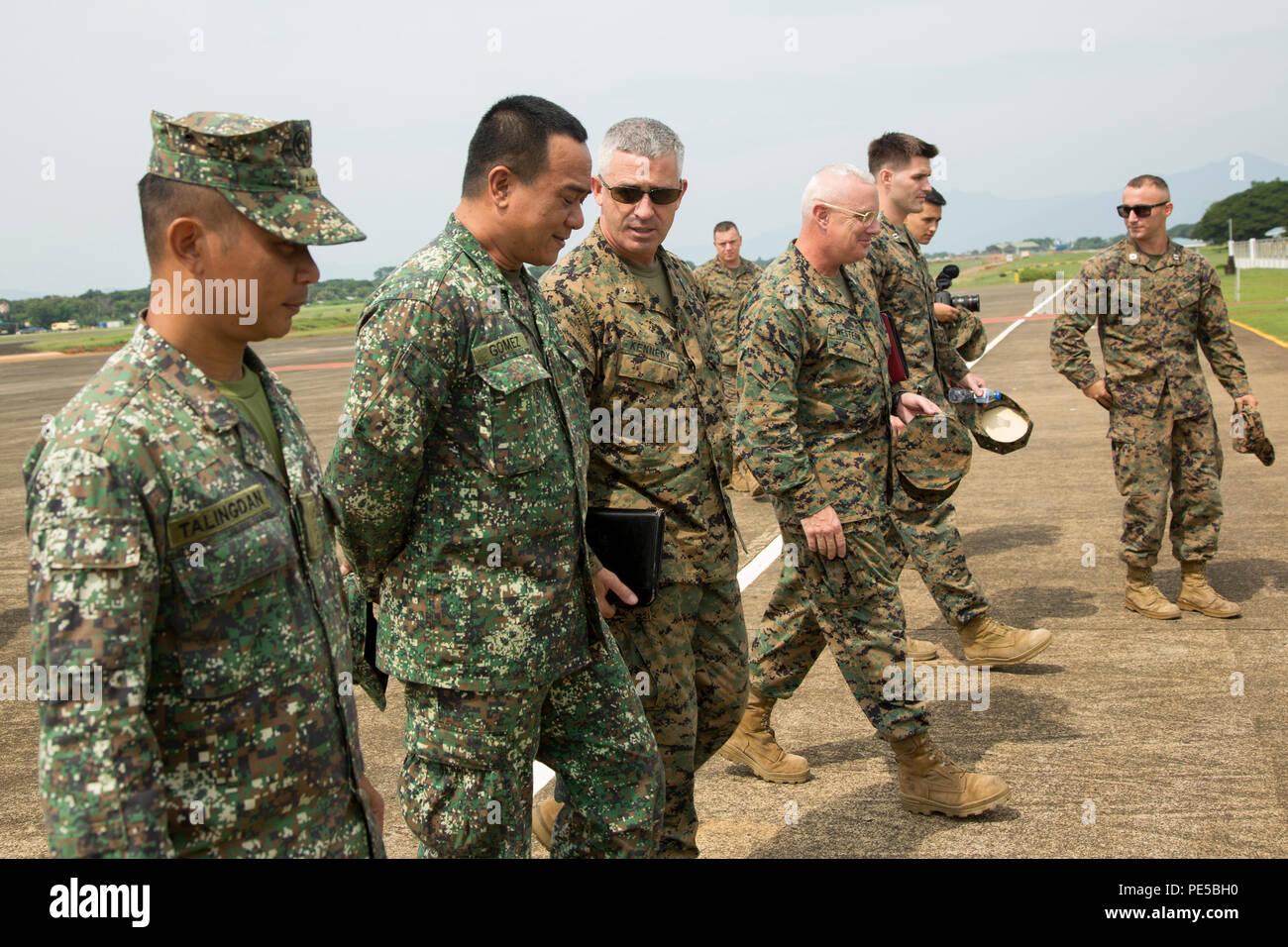 U.S. Marine Corps Brig. Gen. Paul Kennedy, center, commanding general ...