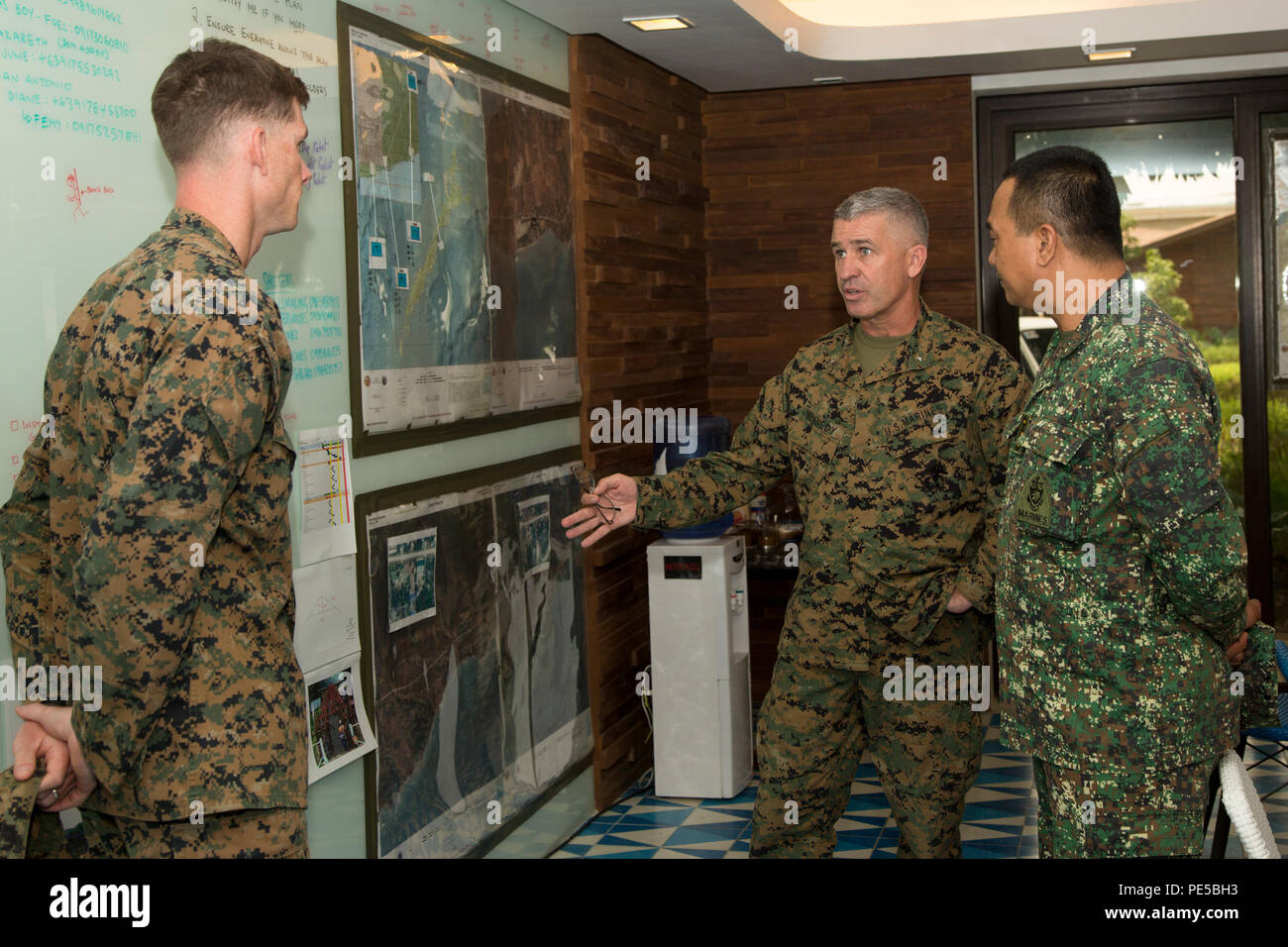 U.S. Marine Corps Brig. Gen. Paul Kennedy, center, commanding general ...
