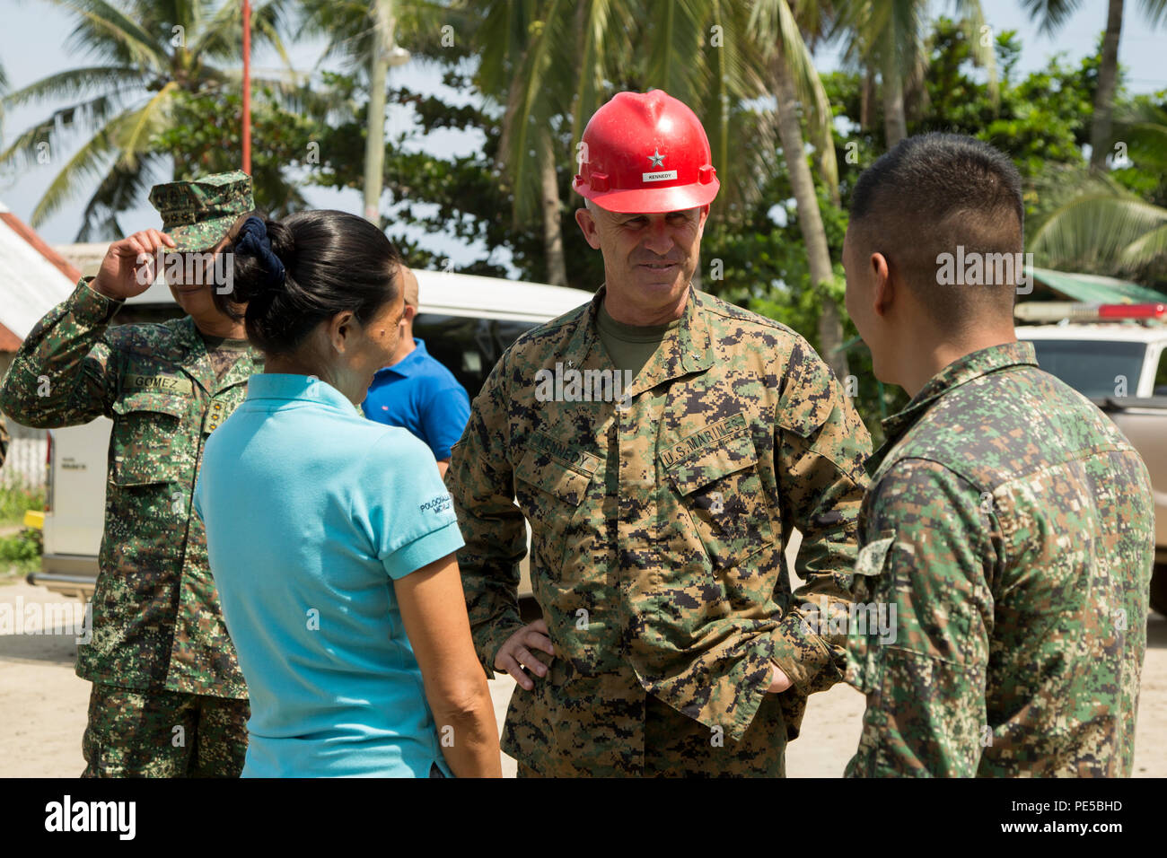 U.S. Marine Corps Brig. Gen. Paul Kennedy, center, commanding general ...