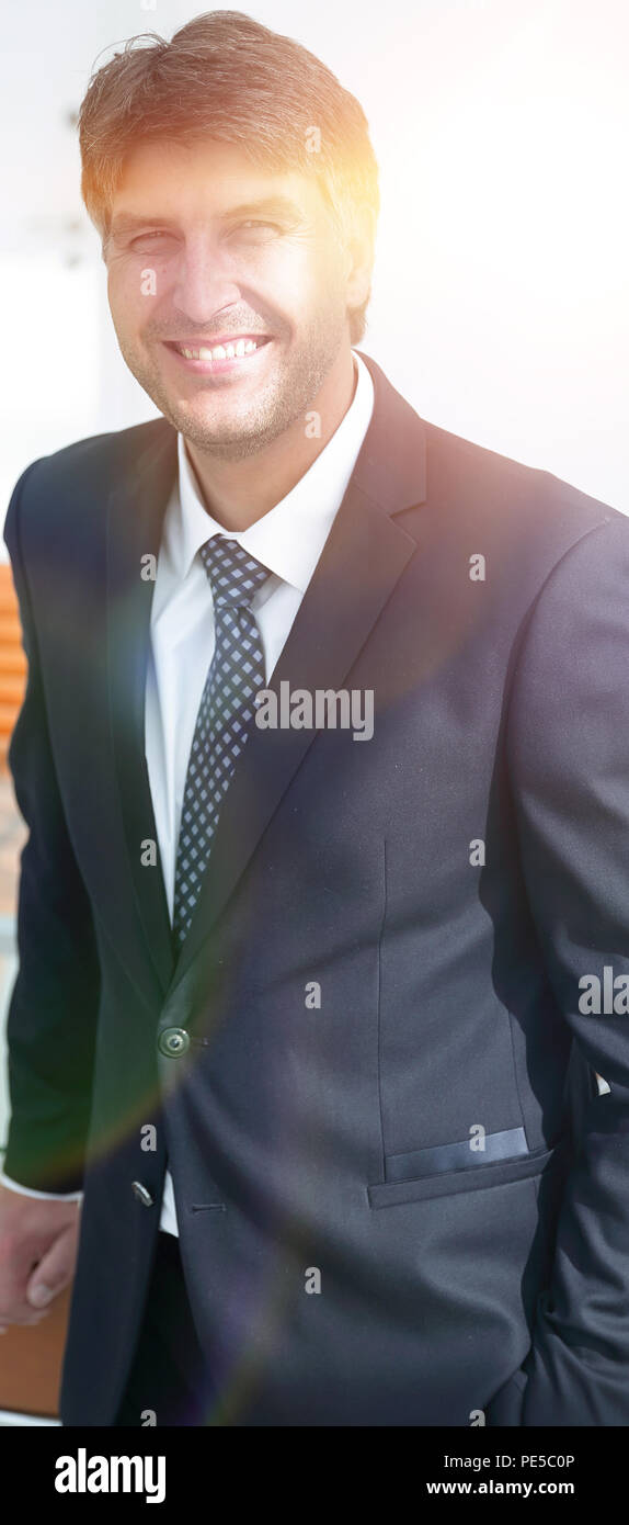 successful businessman standing by the desk Stock Photo - Alamy