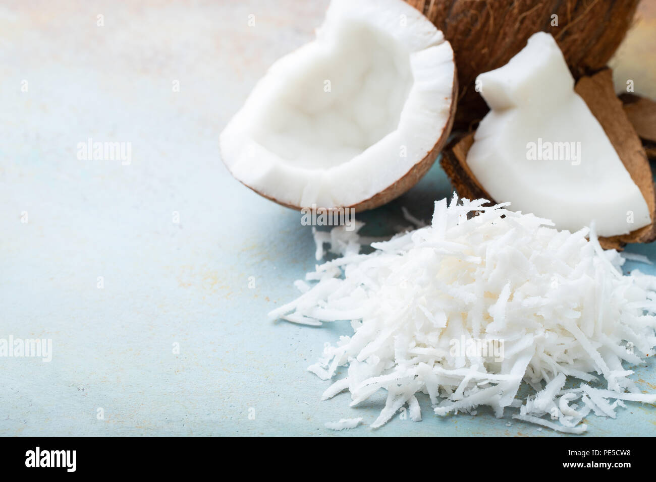 Coconut flakes on a blue background. with copy space Stock Photo - Alamy