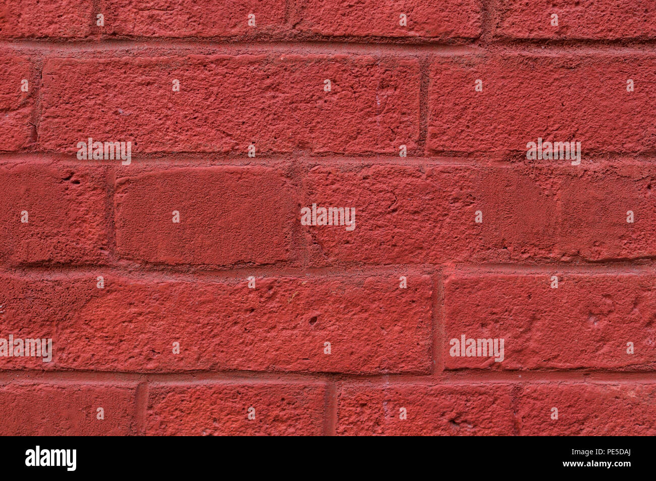 wall of brick painted red background. texture Stock Photo - Alamy