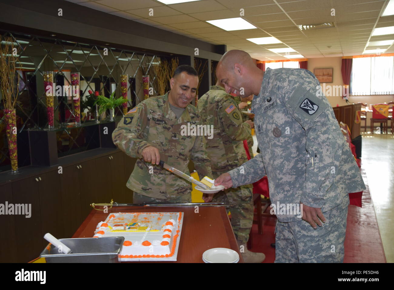 35th ADA Brigade Command Sgt. Maj. Jose Villarreal serves a piece of ...