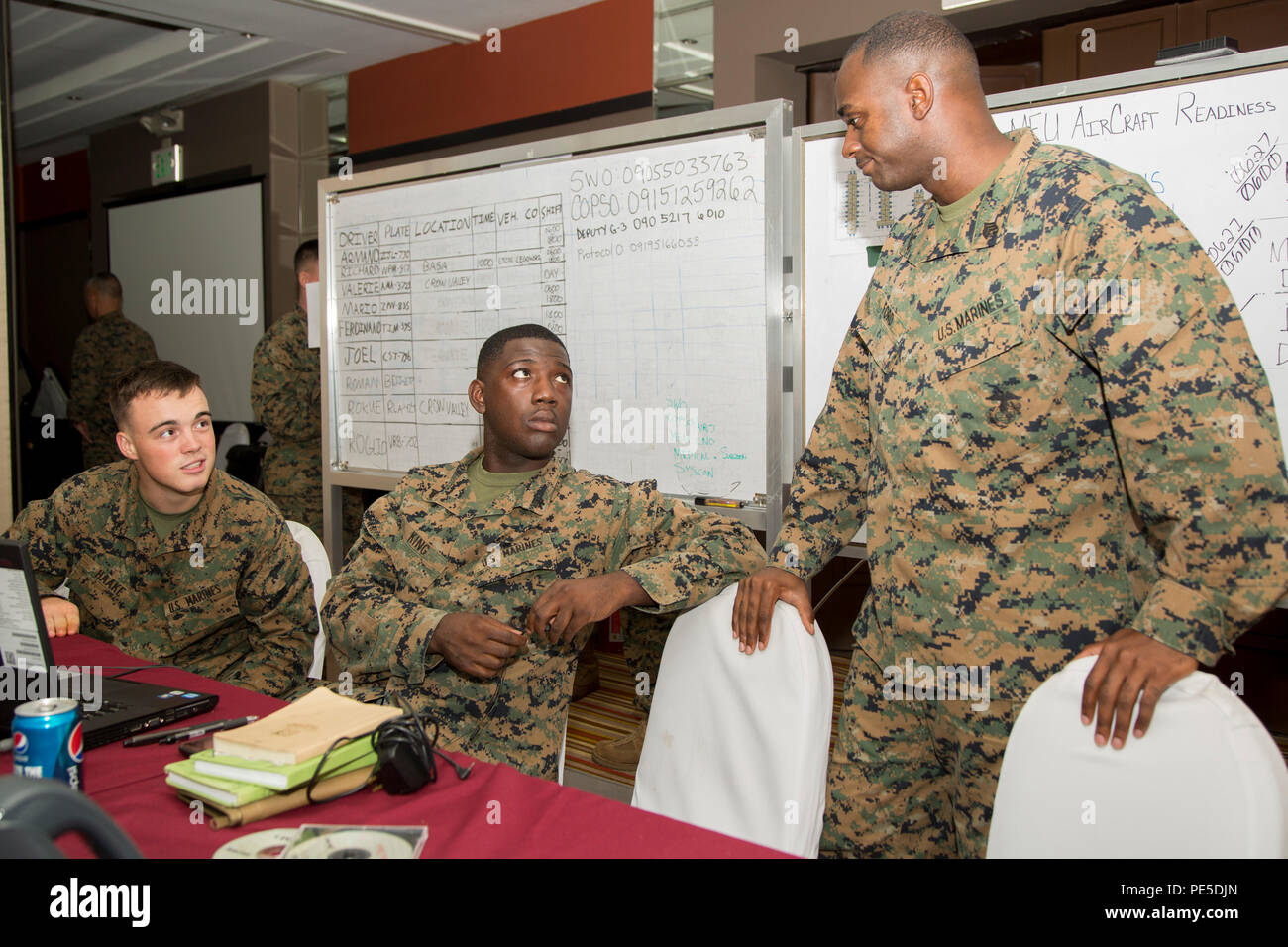 U.S. Marines with 3rd Marine Expeditionary Brigade interact at a ...