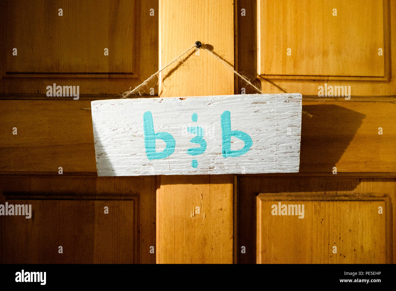 A homemade b&b sign on the door of an airbnb accommodation in ...