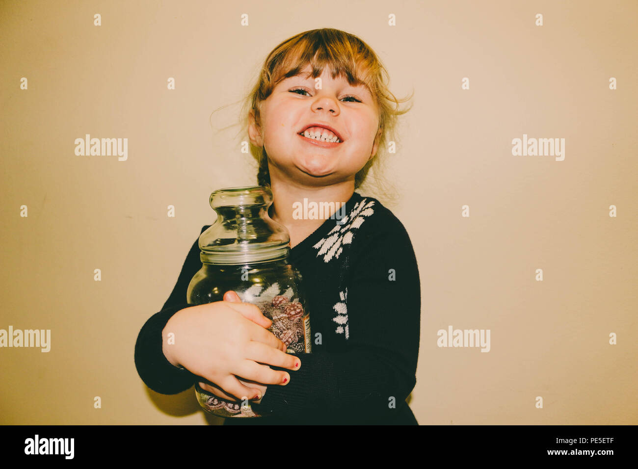 Girl with candy jar hi-res stock photography and images - Alamy