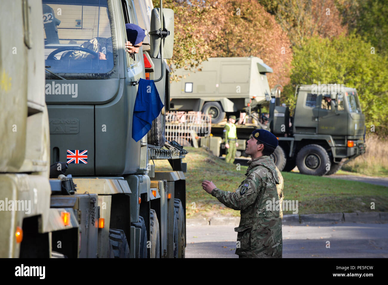 UK 2nd Lt, Sam Adamson, the convoy commander, gives orders on the ...