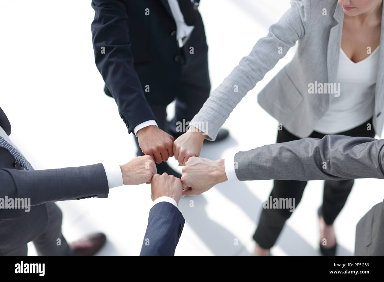 young people putting hands together Stock Photo - Alamy