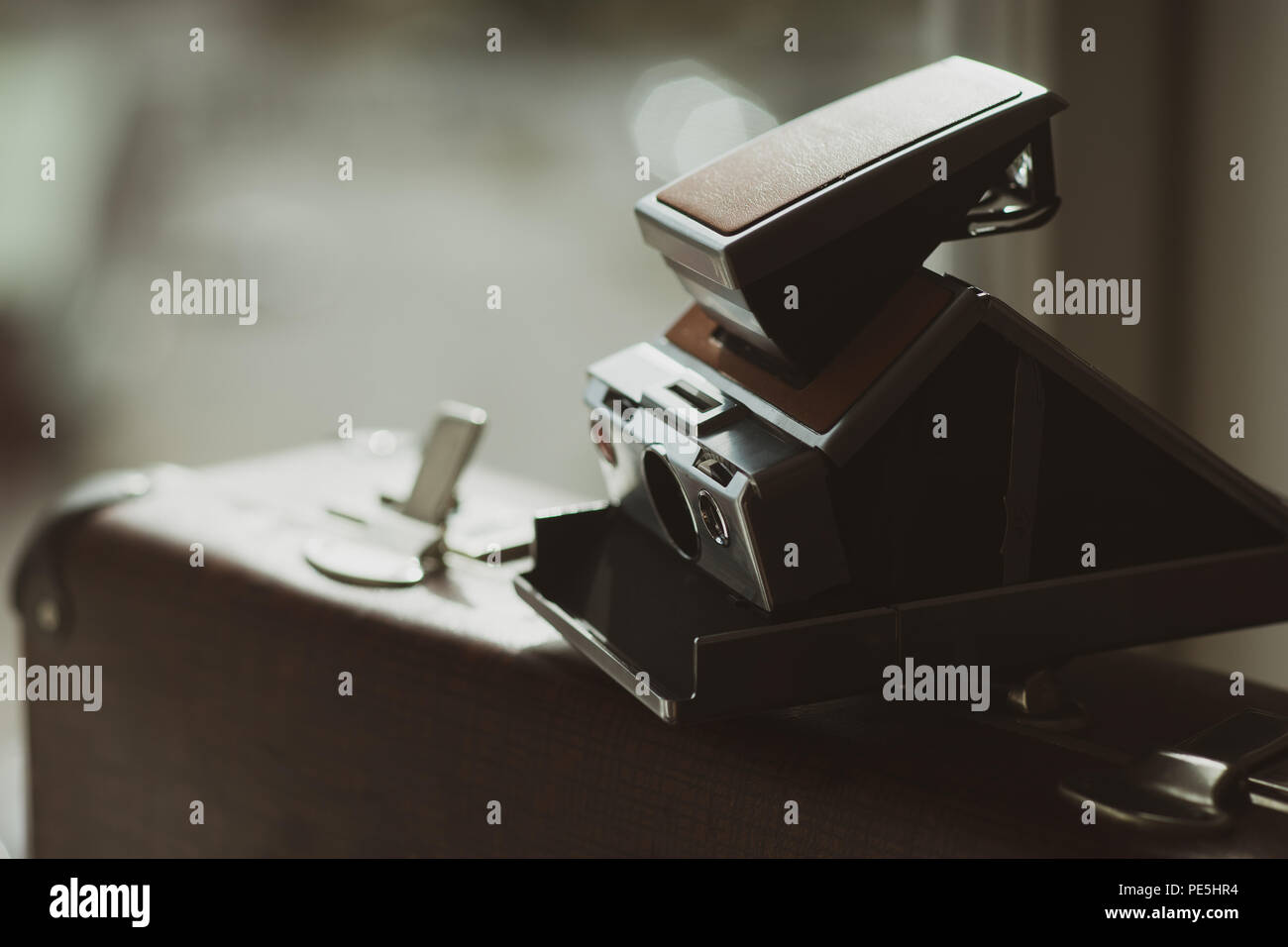 Vintage snapshot camera on an old suitcase with an open lock Stock ...
