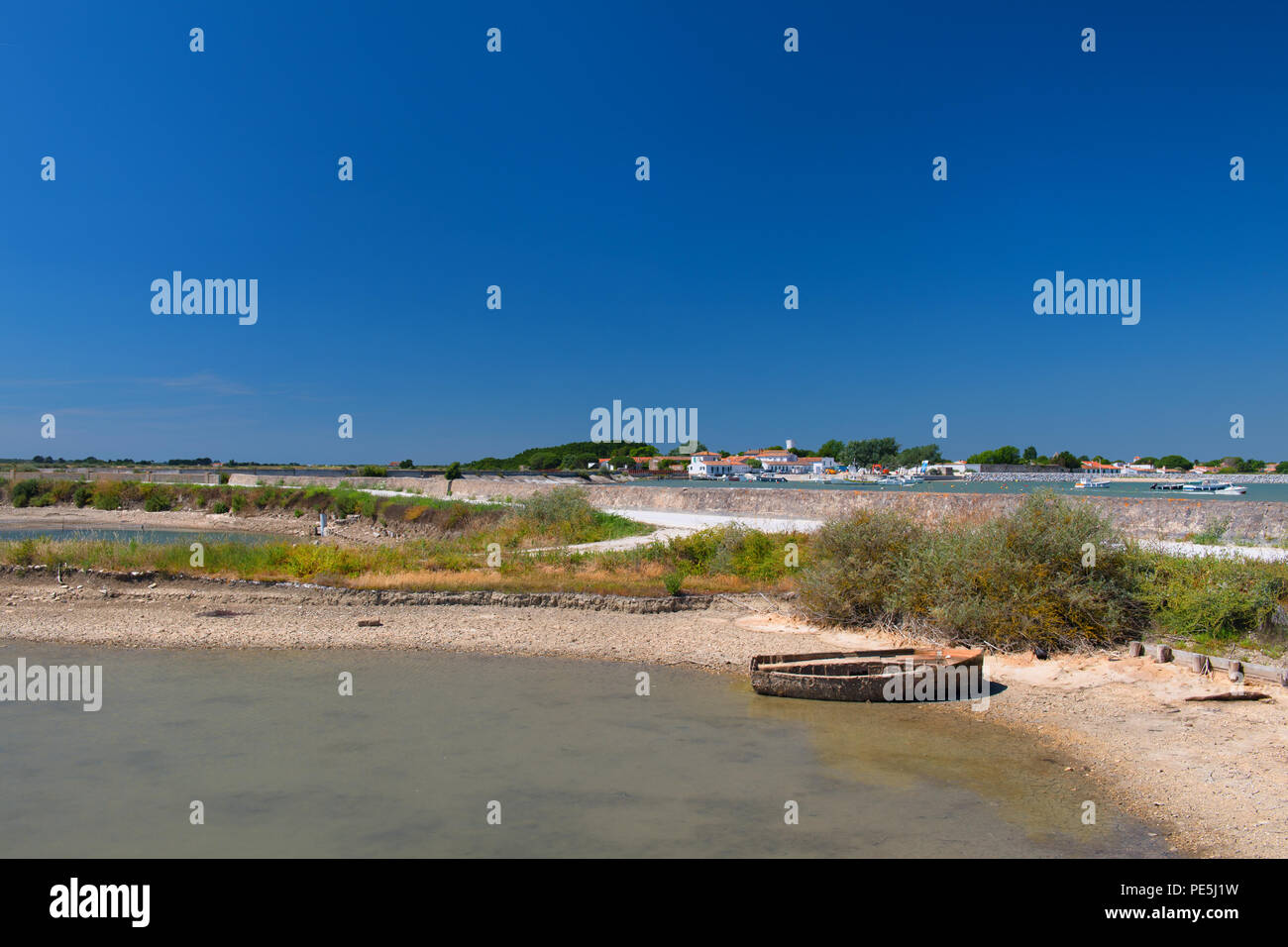 Ile de Ré landscape with village Loix and salt lake with boat Stock ...